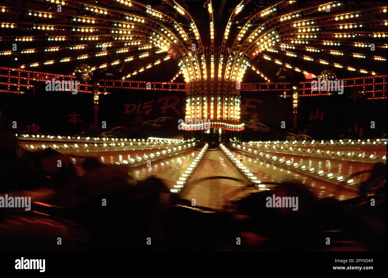 Driving business at the Oktoberfest in Munich by night Stock Photo - Alamy