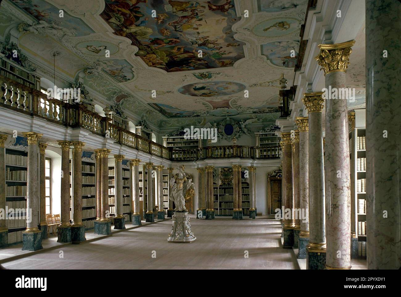 The sumptuous Baroque library hall in Ottobeuren Abbey has a gallery ...