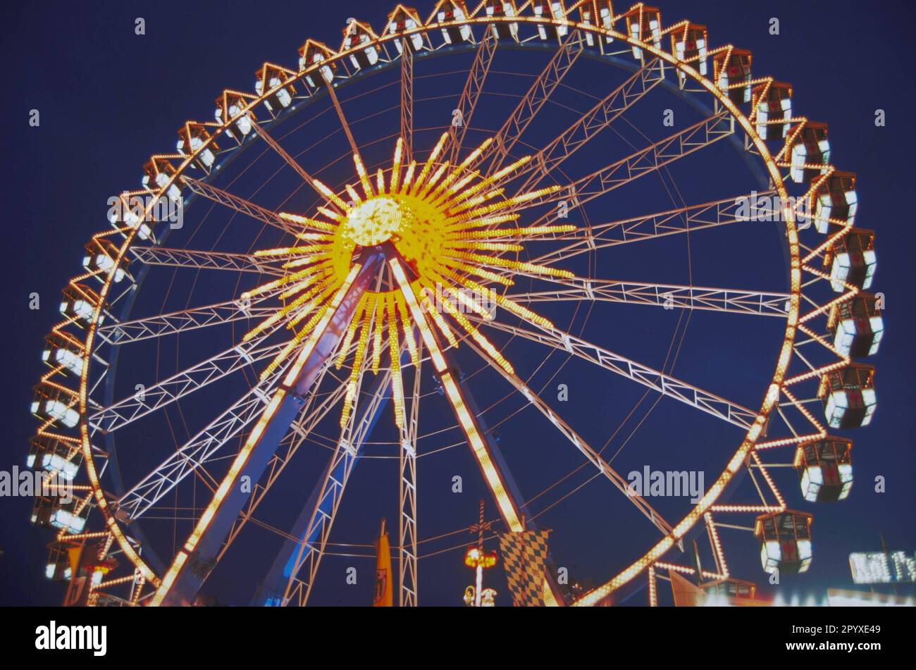 Big wheel by night at the Oktoberfest in Munich Stock Photo - Alamy