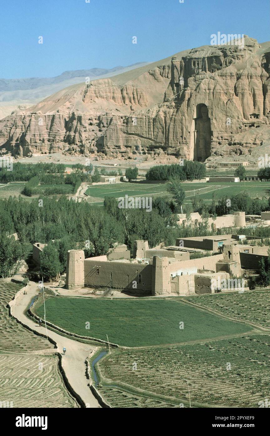 View of the fortified clay castles and the cave group of the Buddhist ...