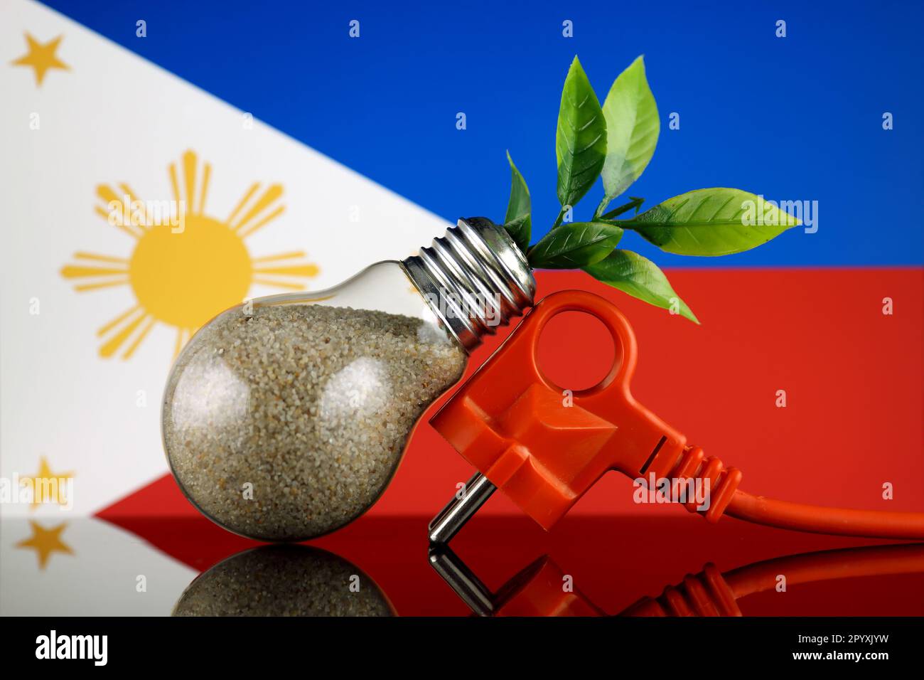 Plug, plant growing inside the light bulb and Philippines Flag. Green ...