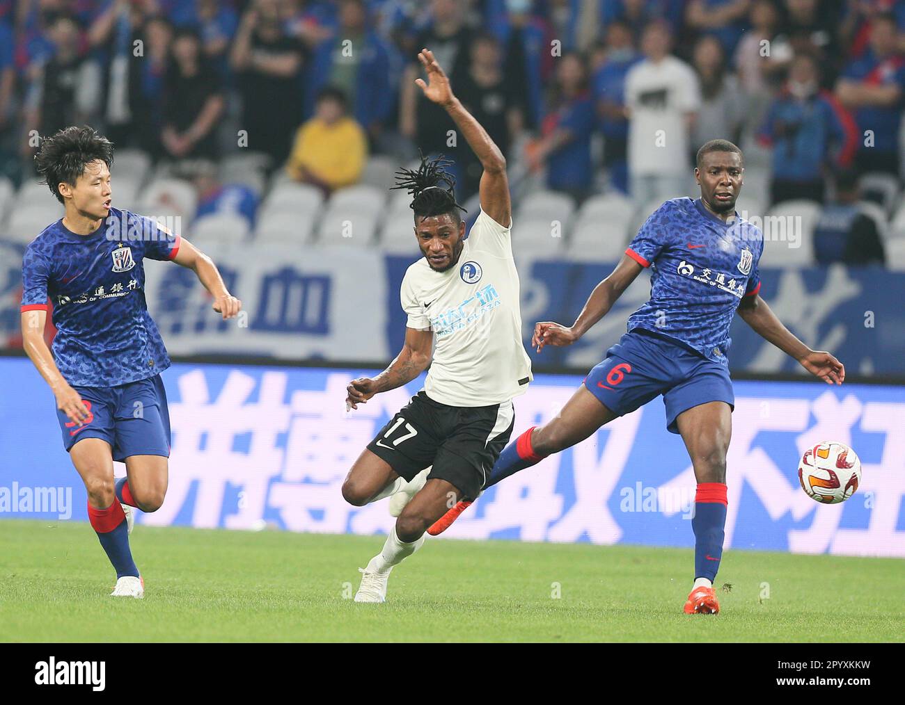 Shanghai. 5th May, 2023. Cesar Manzoki (C) of Dalian Professional ...