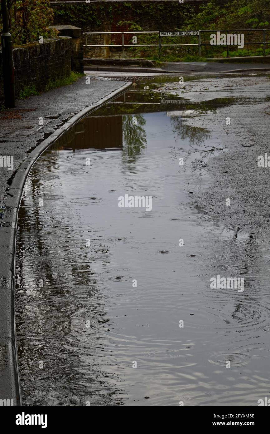 A roadside drain on Bridge Street, New Mills, Derbridge is overflowing ...