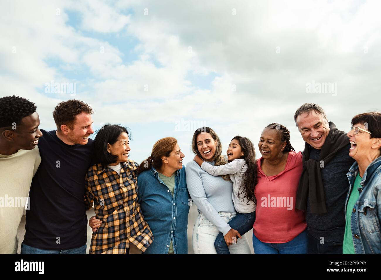 Happy multigenerational friends with different ethnicity having fun at ...