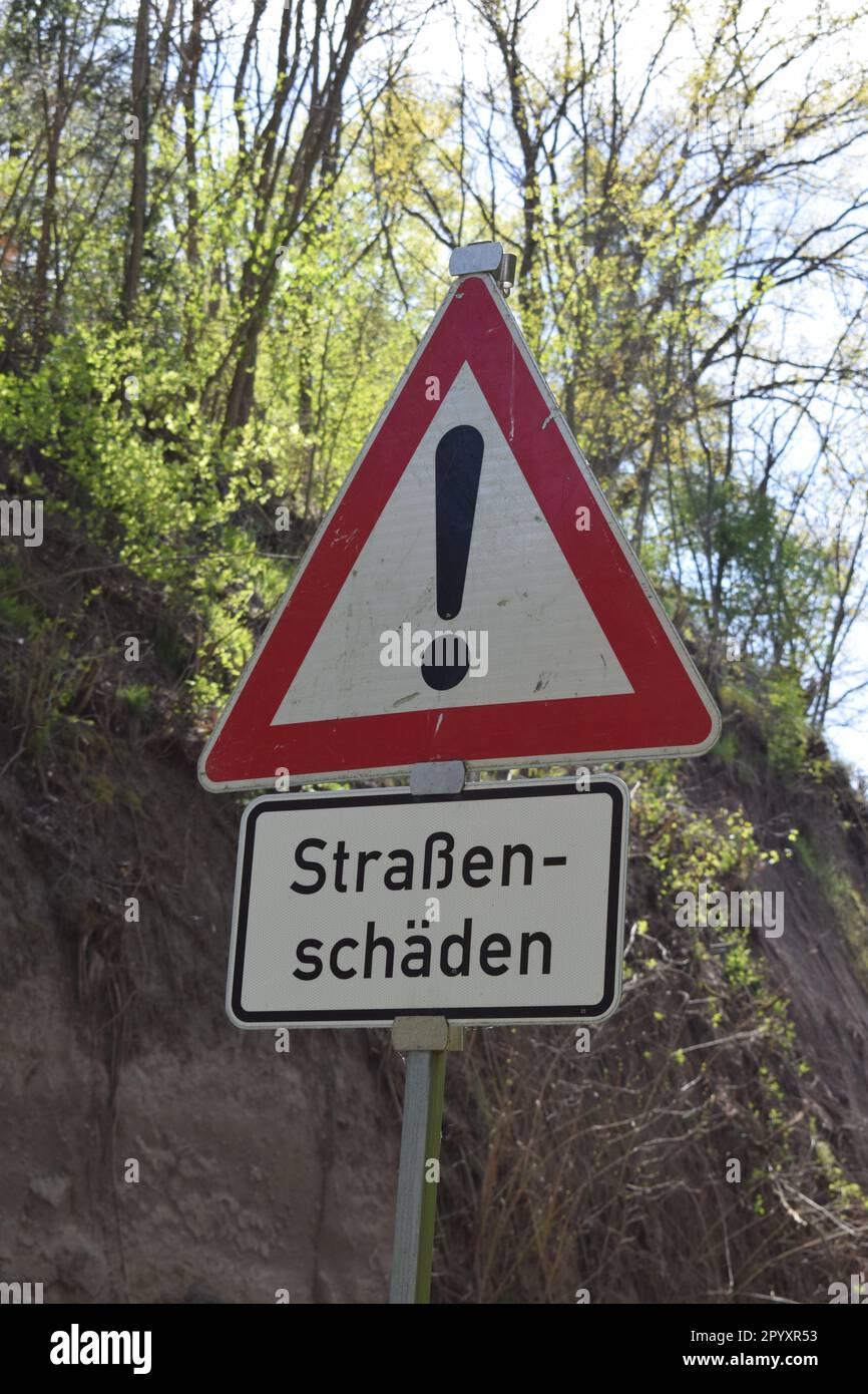 Road Damage Warning Sign in Germany Stock Photo - Alamy