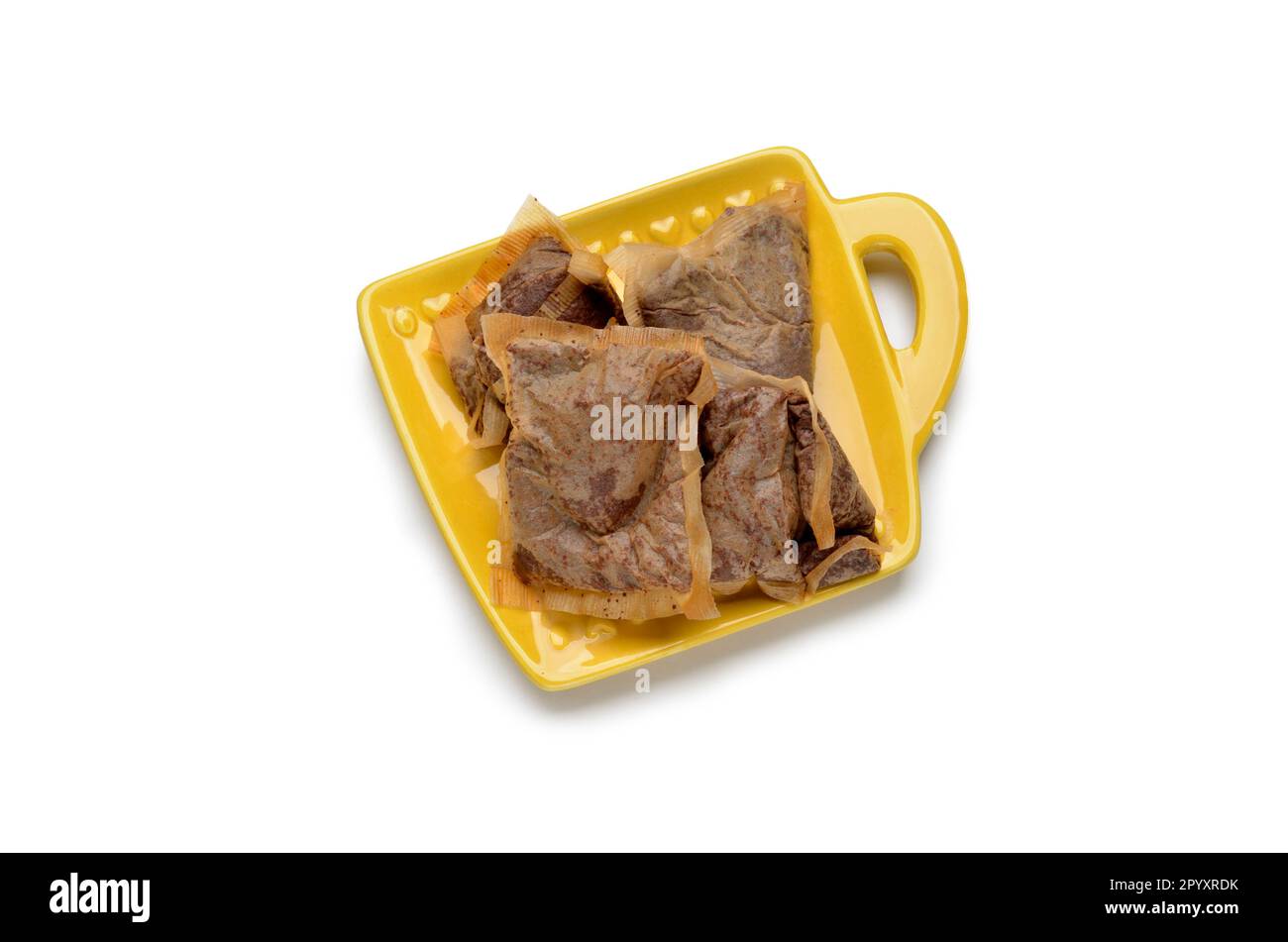 Ceramic yellow dish or plate used for discarding used teabags in ...