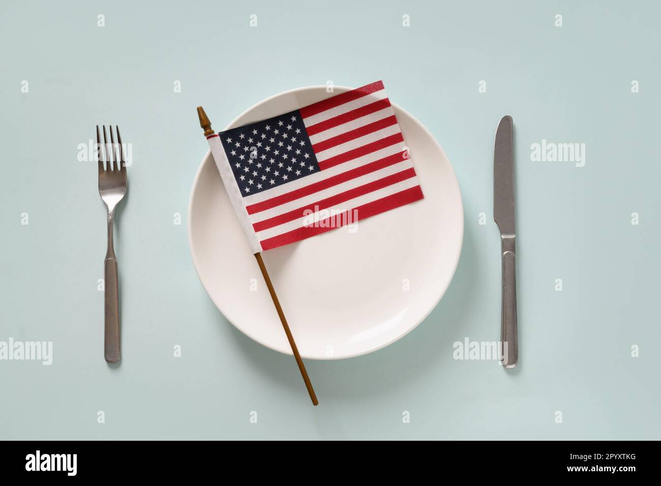 Patriotic table setting with American flag on blue background ...