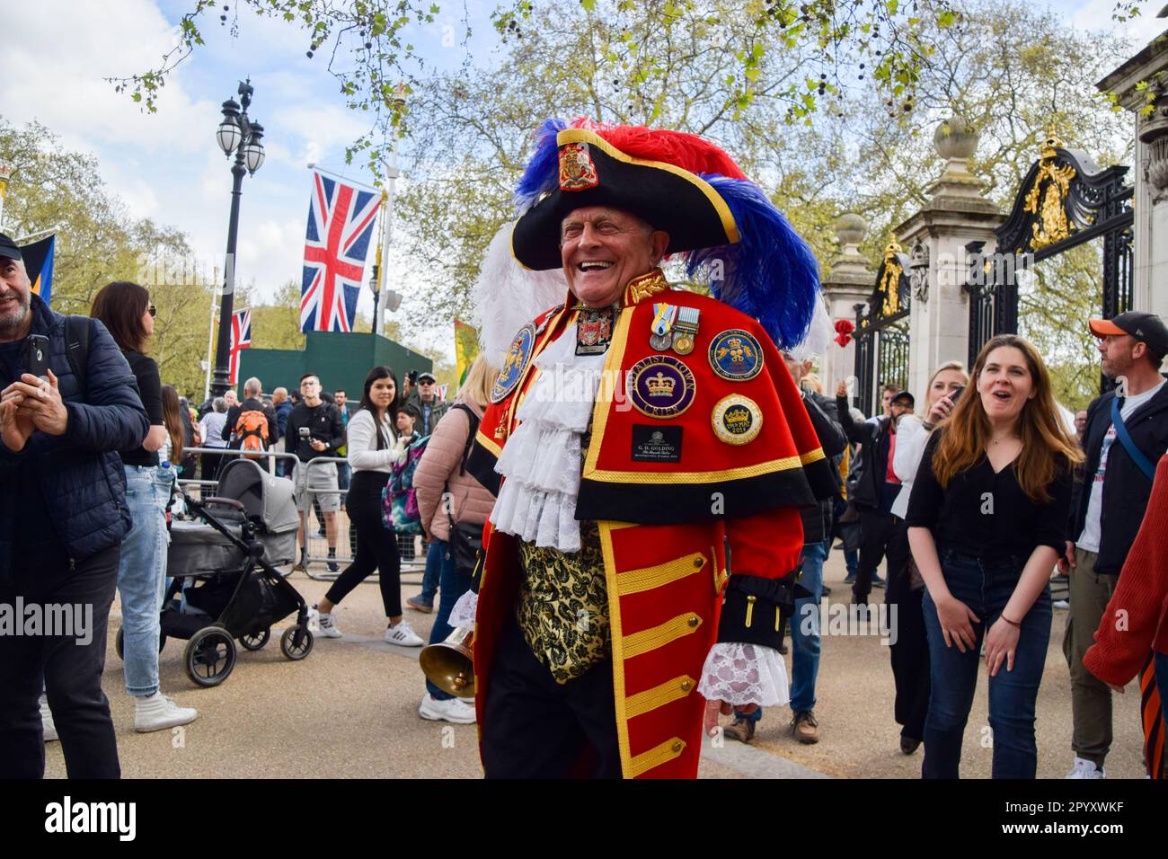 London, UK. 5th May 2023. A town crier walks through the royal superfan ...