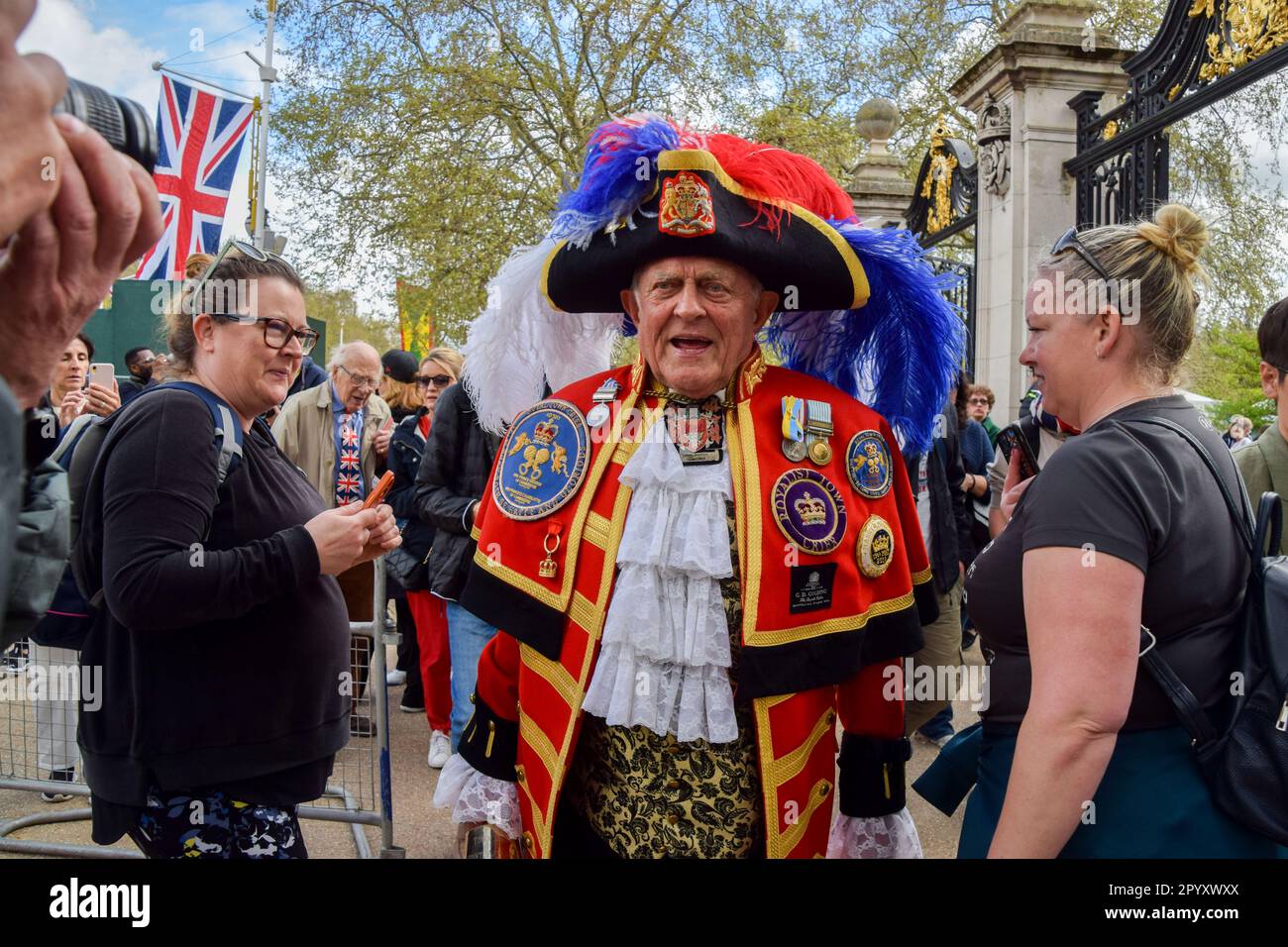 London, UK. 5th May 2023. A town crier walks through the royal superfan ...