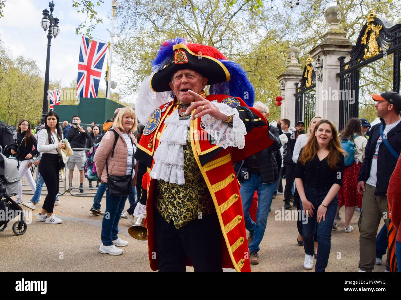 London, UK. 5th May 2023. A town crier walks through the royal superfan ...