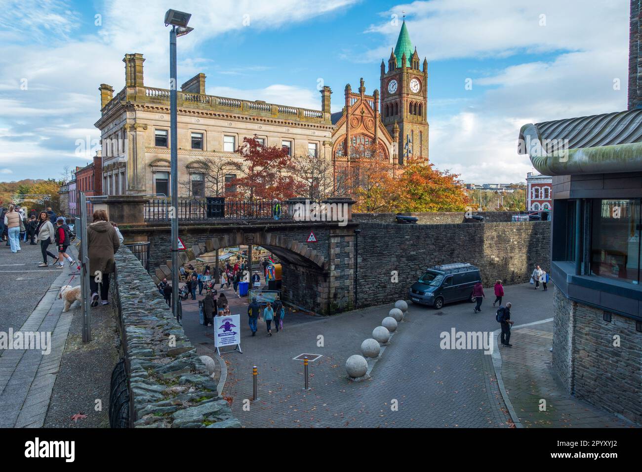 Magazine gate on the old city walls, with the Guildhall in the ...