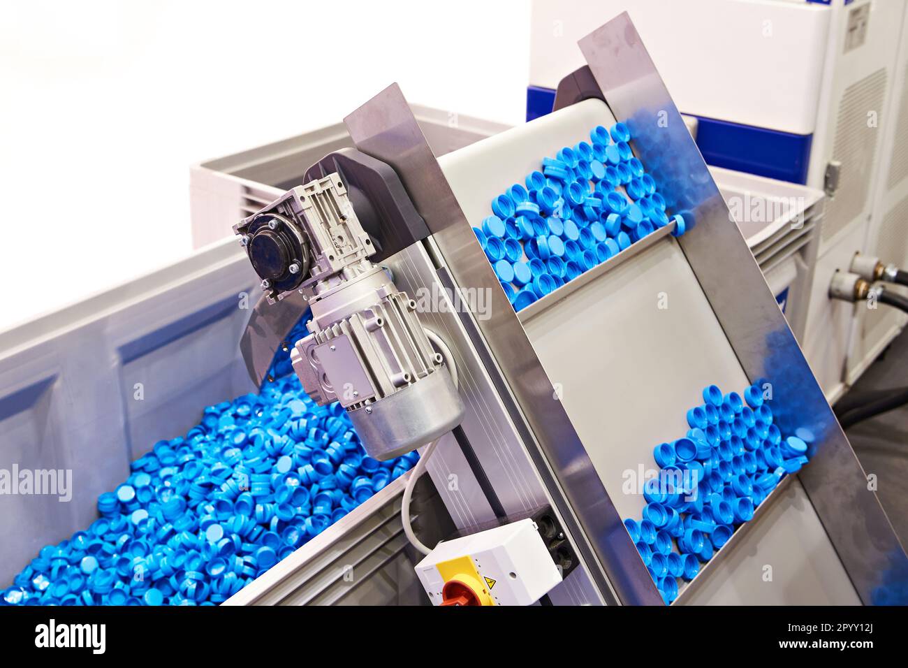 Conveyor on machine for production of plastic cap for bottles Stock ...