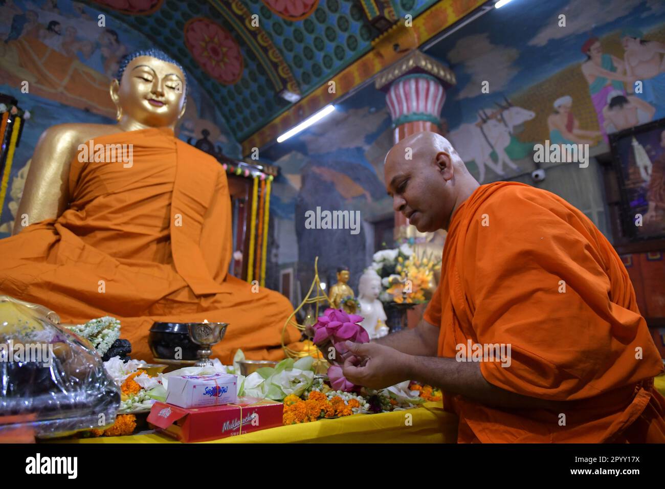 Kolkata, India. 05th May, 2023. An Indian Buddhist monk offering a ...