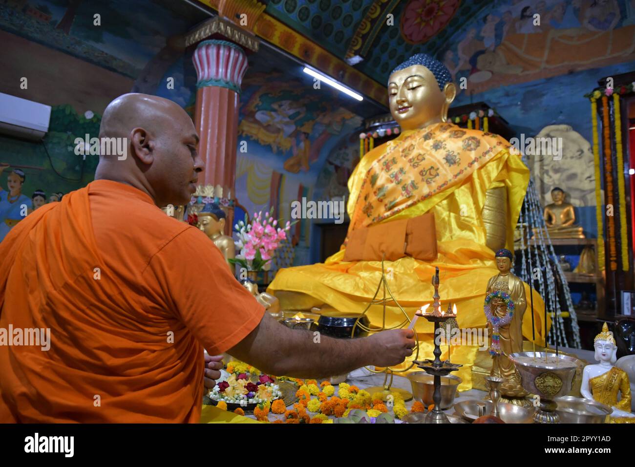 Kolkata, India. 05th May, 2023. An Indian Buddhist monk lighting ...