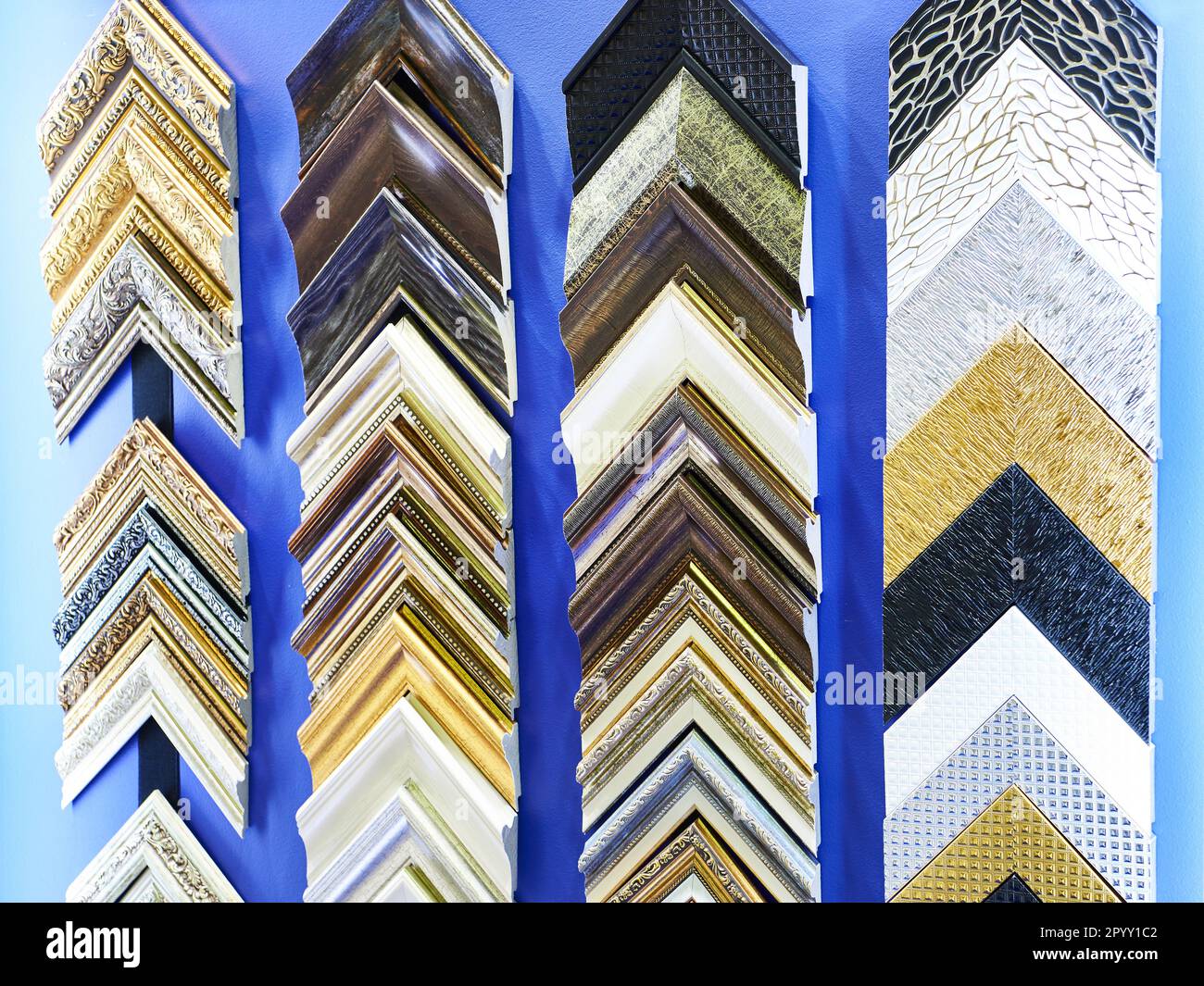 Samples of frames and cornices in the store Stock Photo - Alamy