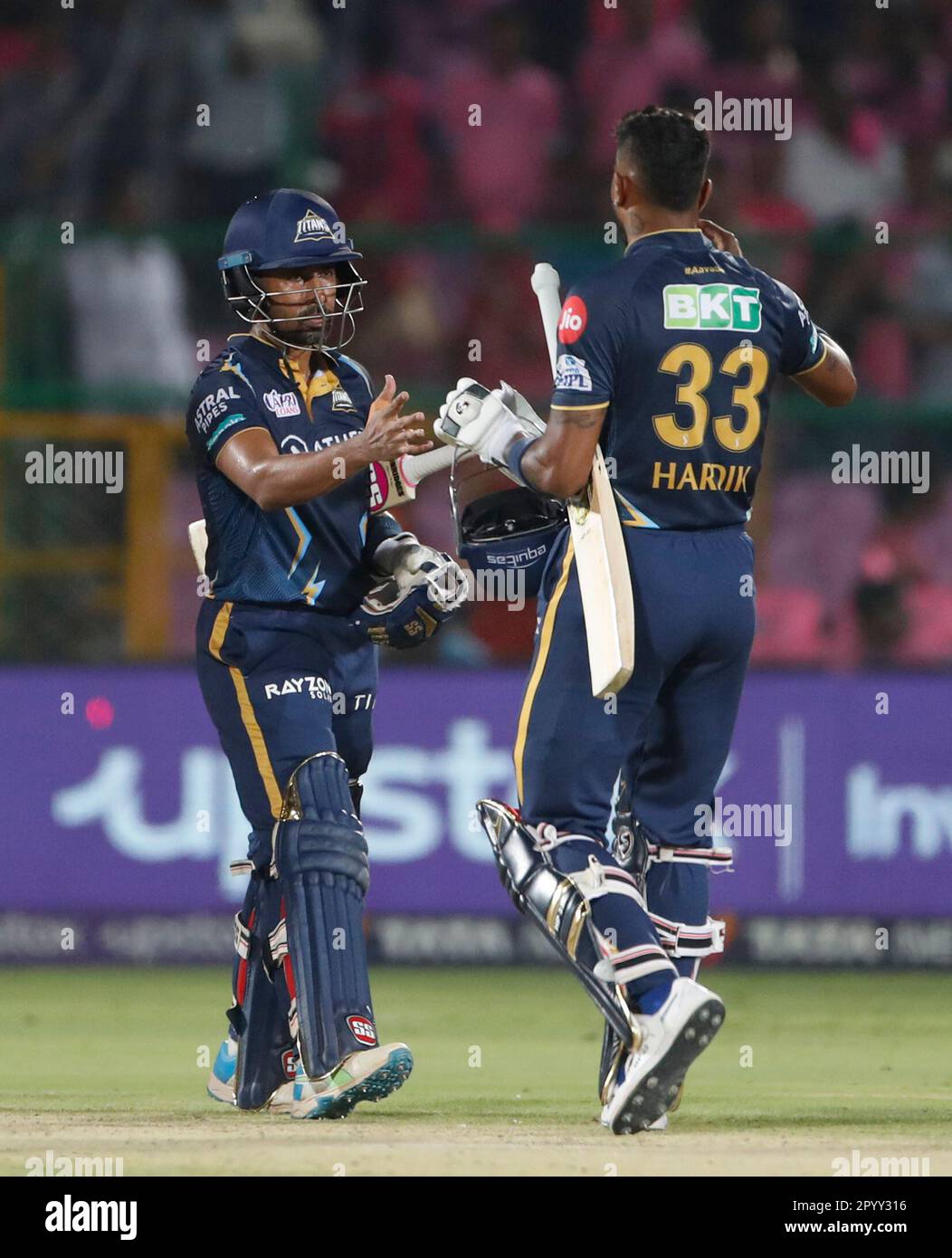 Gujarat Titans' captain Hardik Pandya, right, and Gujarat Titans ...