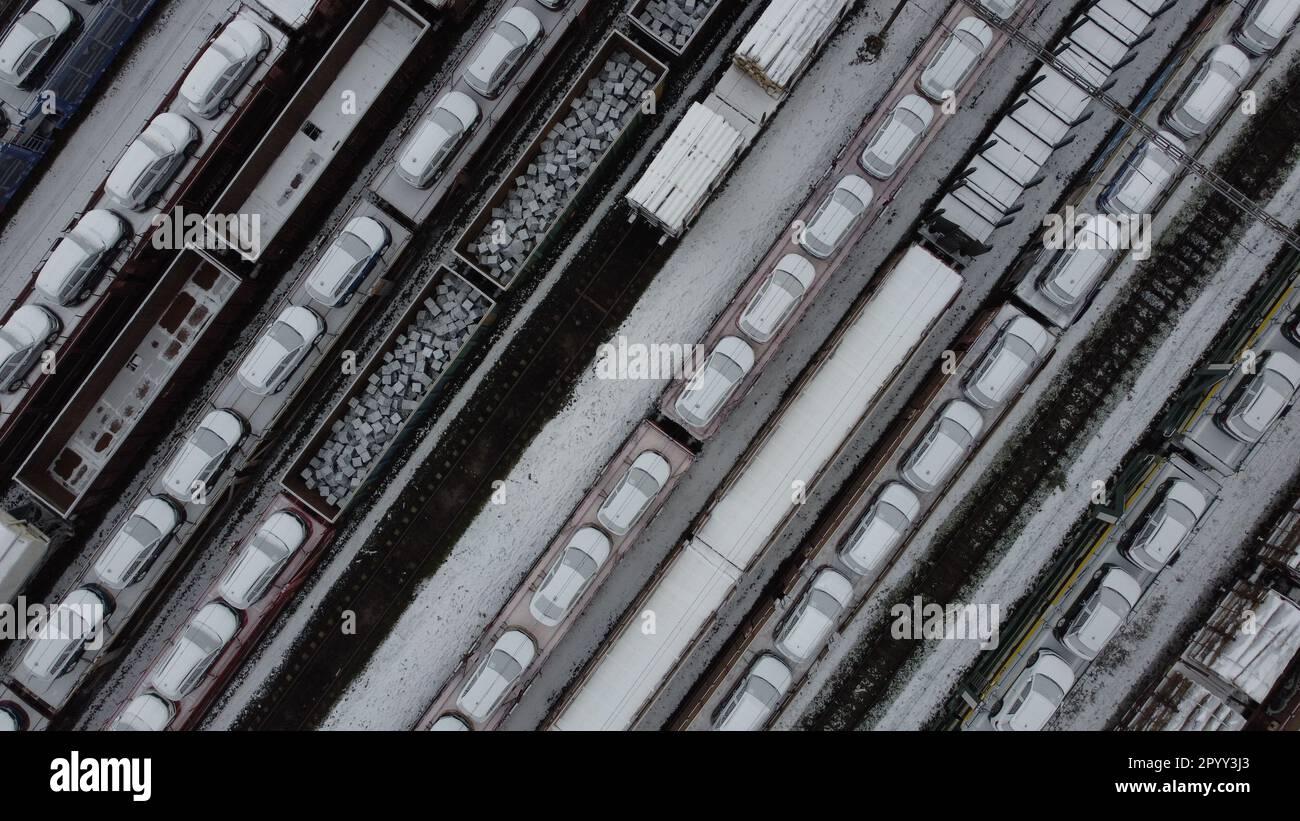 An aerial view of a train yard with multiple railway lines, with cars ...