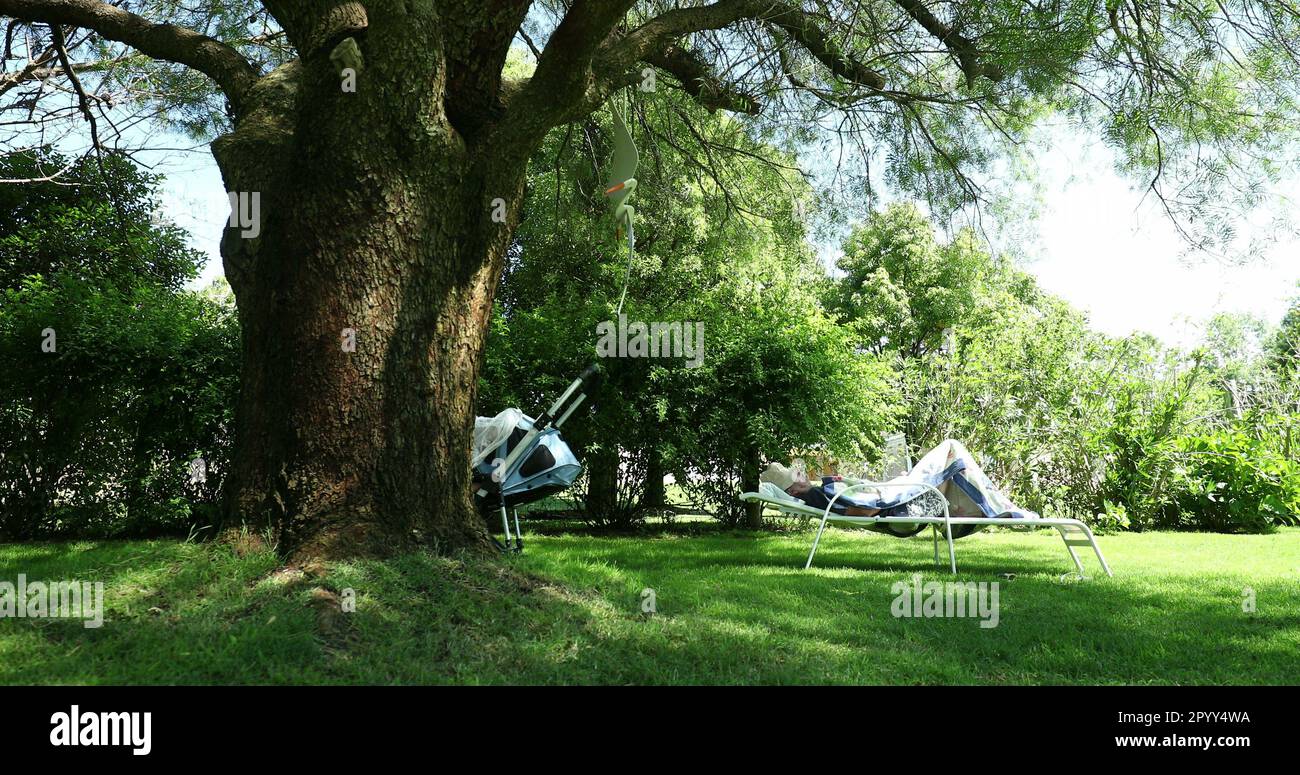 Man napping under a tree hi-res stock photography and images - Alamy