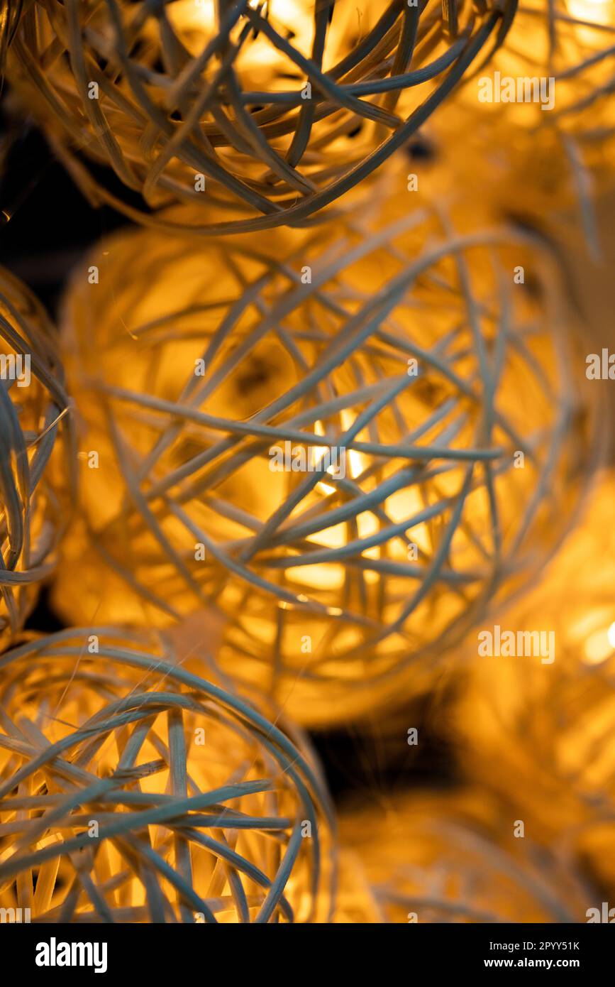 A close-up of a multicolored, spherical object with long, light-like ...