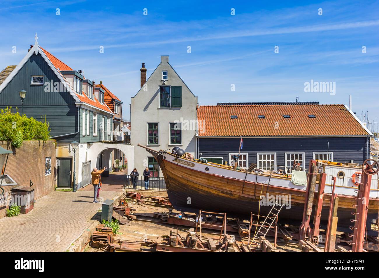 Old wooden ship at the wharf in fishing village Urk, Netherlands Stock ...