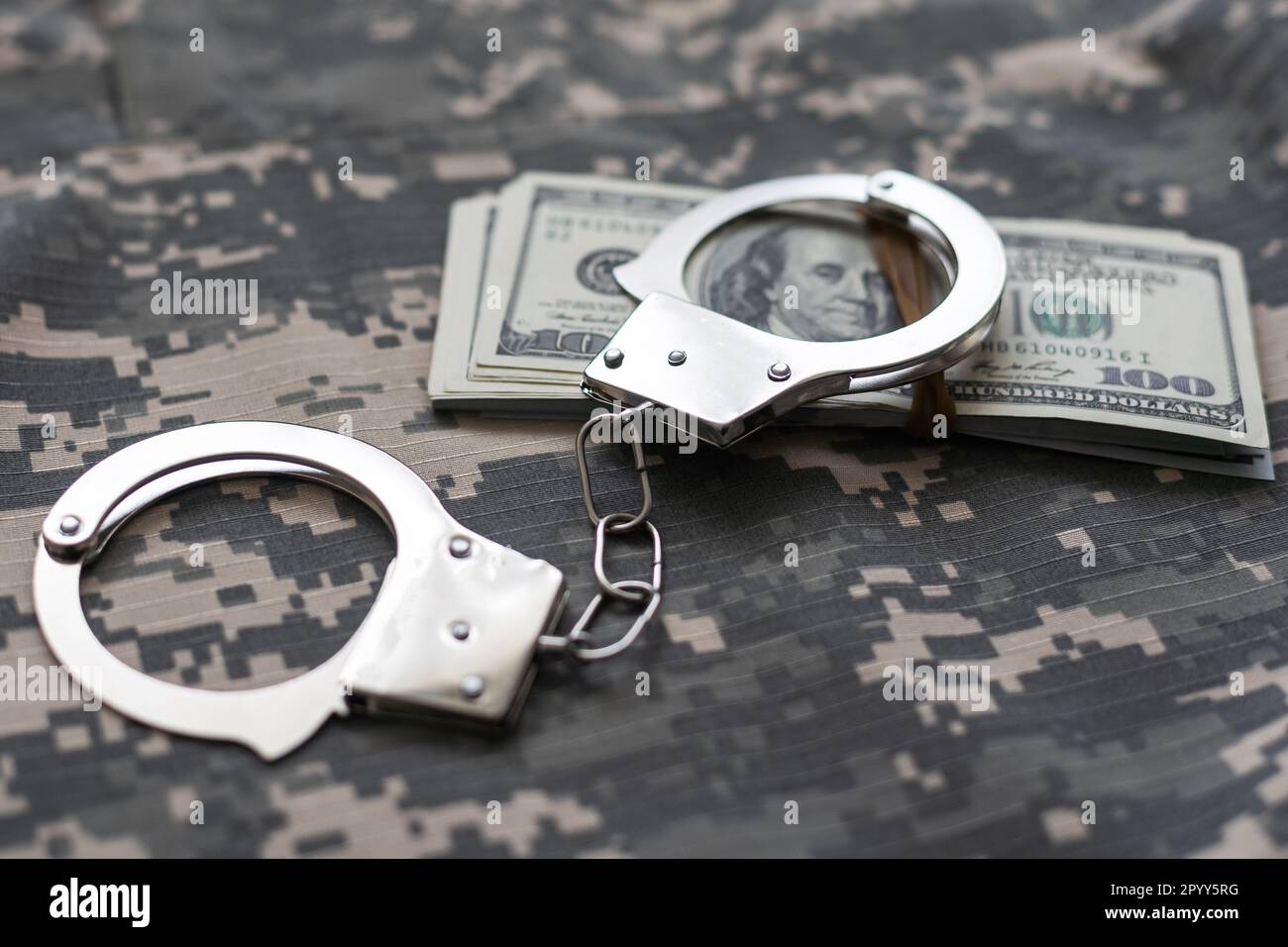 military uniform and handcuffs, money Stock Photo - Alamy
