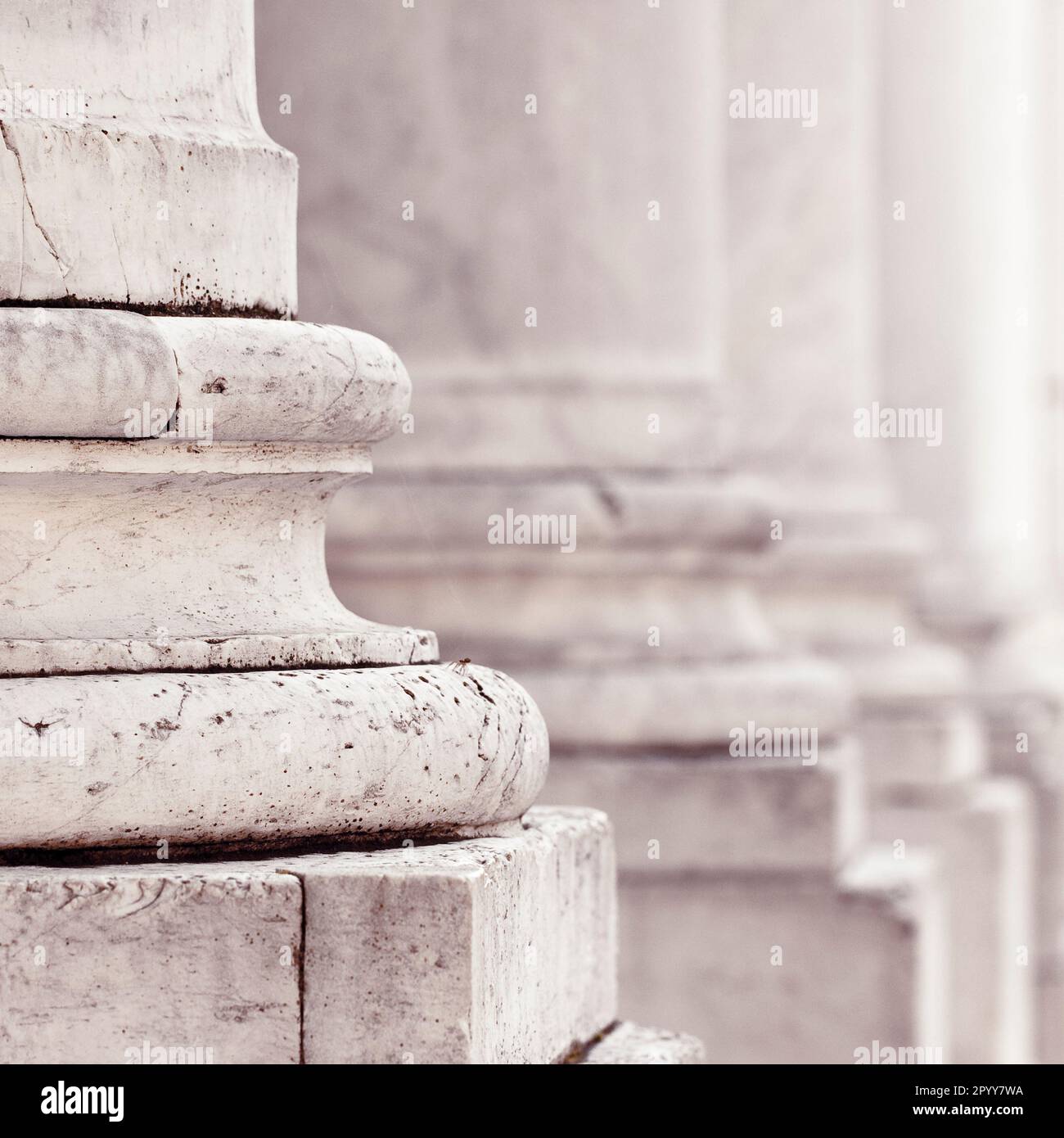 Base of the marble columns of a romanesque medieval Italian church ...