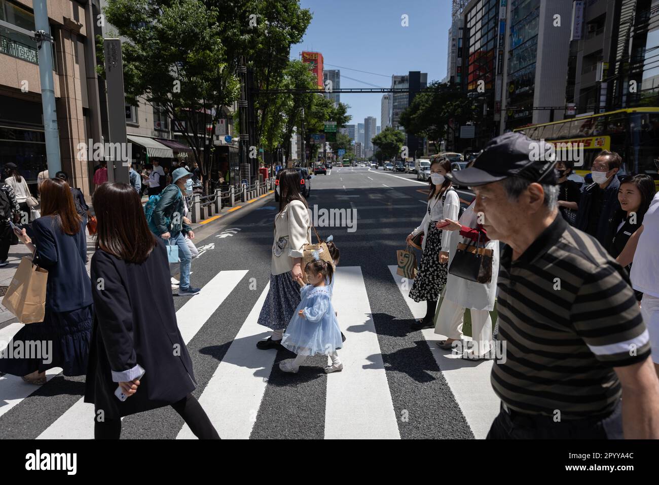 Tokyo, Japan. 2nd May, 2023. Pedestrians walk over a crossroad in Ginza ...