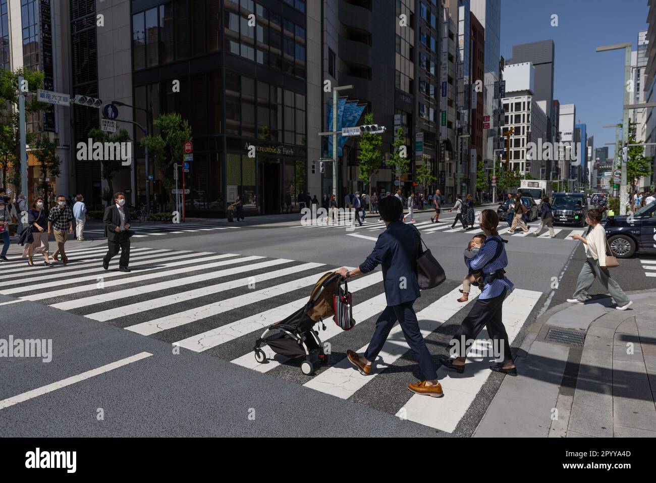 Tokyo, Japan. 2nd May, 2023. A family walks over a crossroad in Ginza ...