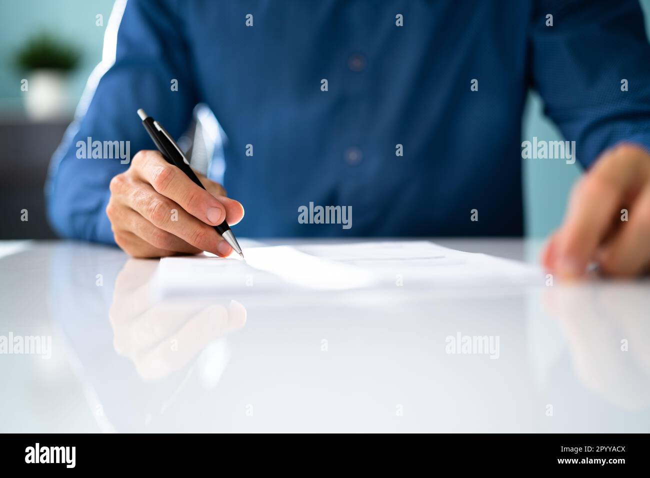 Agreement Signature With Pen. Hand Signing Paper Form Stock Photo - Alamy