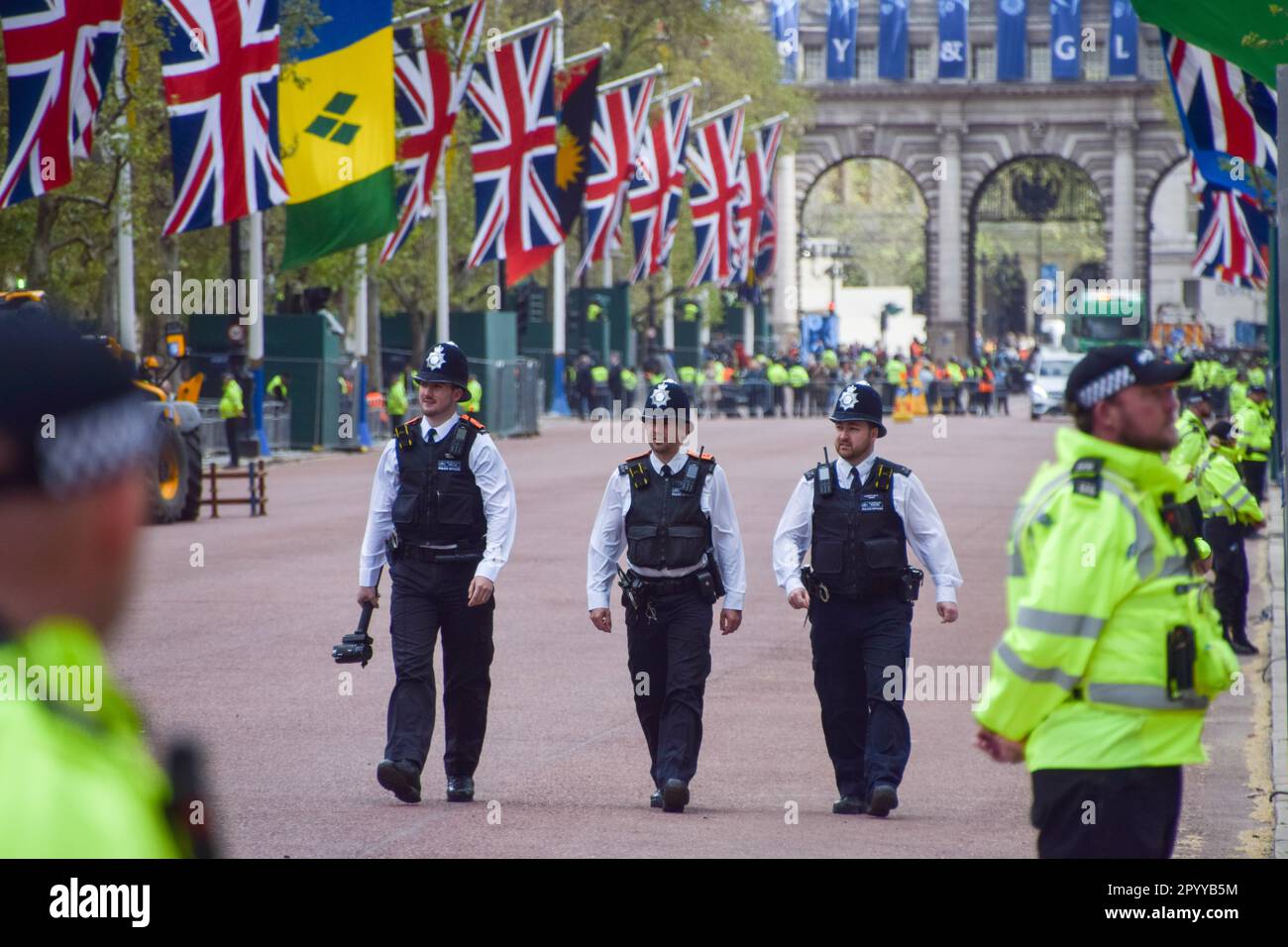 London, UK. 5th May 2023. Police officers with a video camera patrol ...