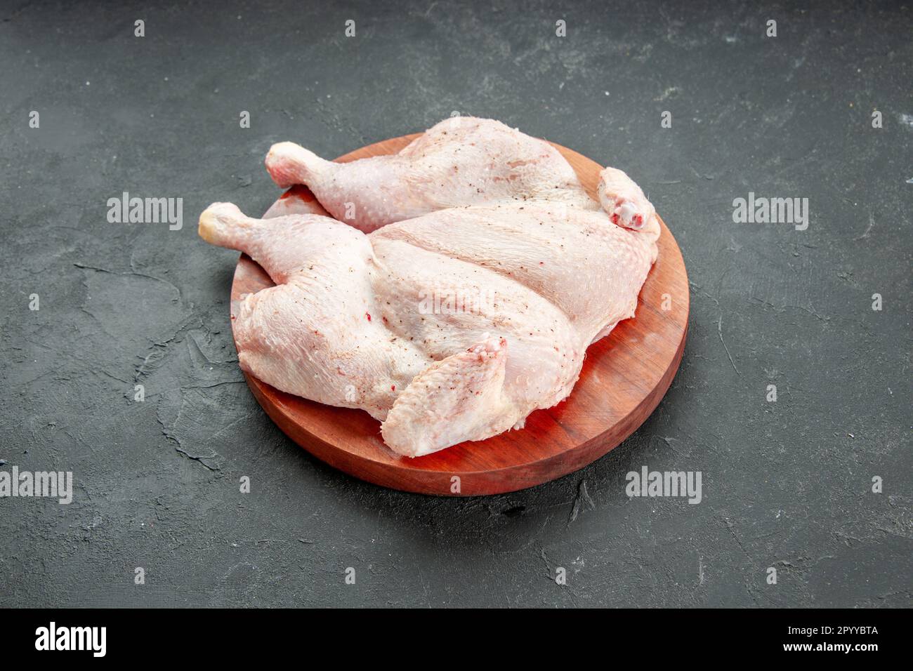 front view fresh raw chicken on a dark background cooking dish food ...