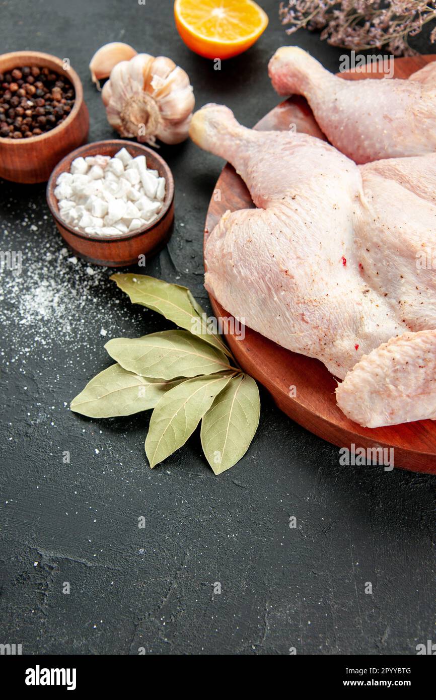 front view fresh chicken on dark background cooking salad color bird ...