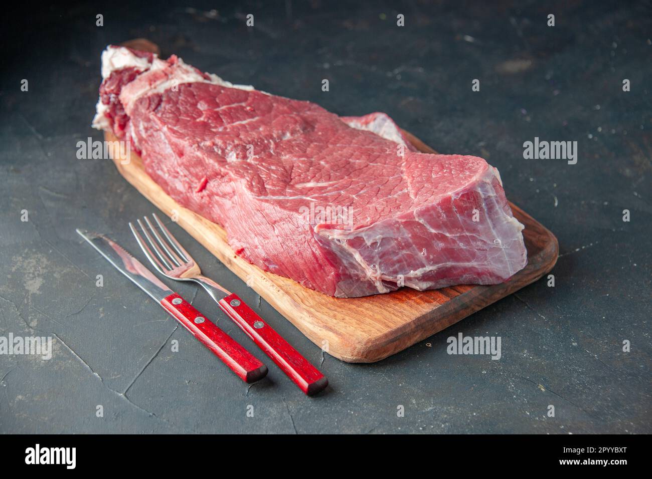 front view raw meat slice on dark background color butcher meal food ...