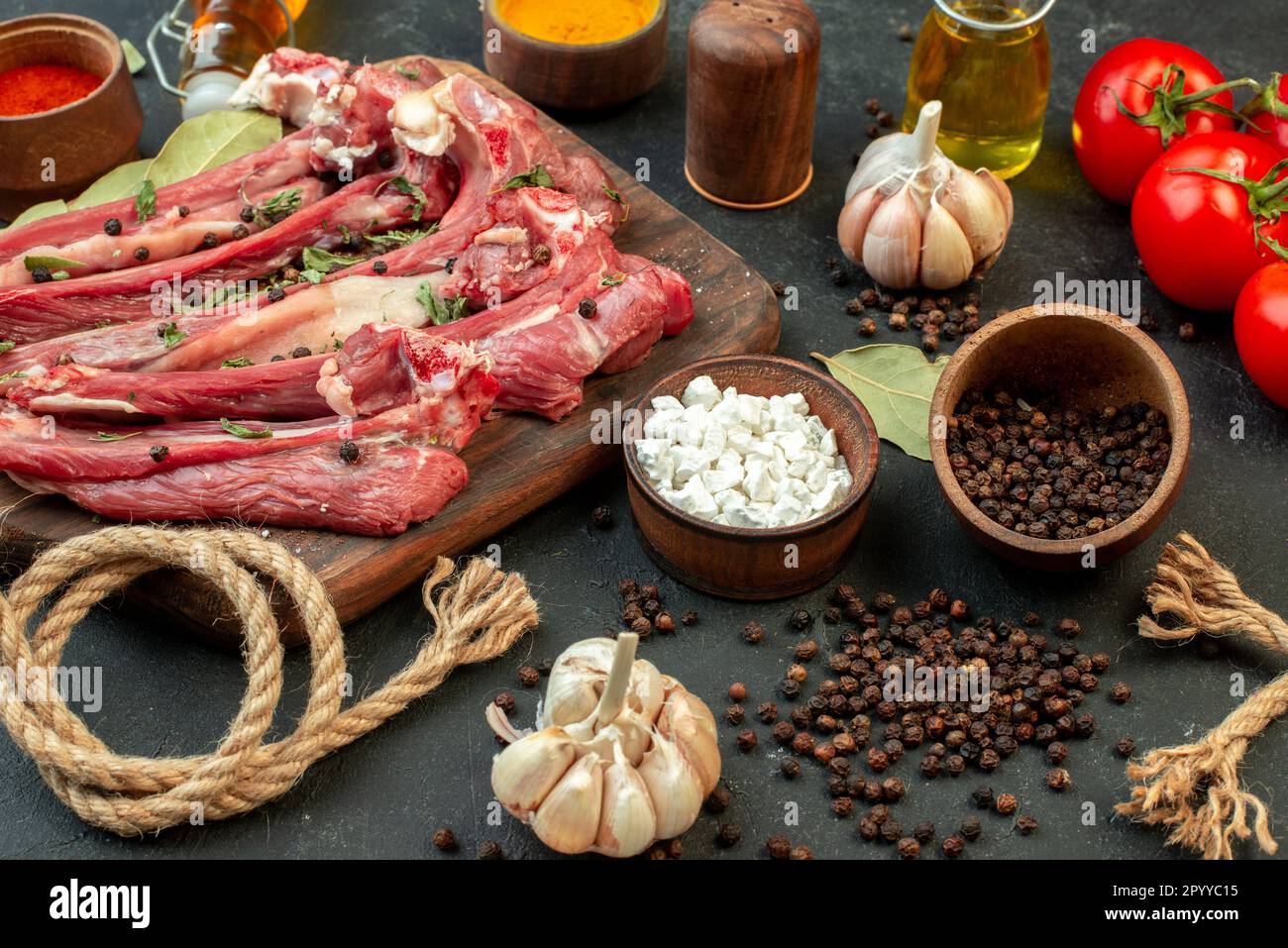 front view raw meat slice with fresh vegetables and seasonings on a ...