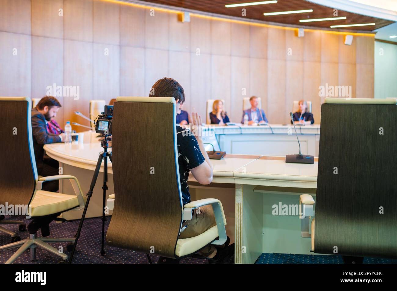 People sitting at round table during meeting Stock Photo - Alamy