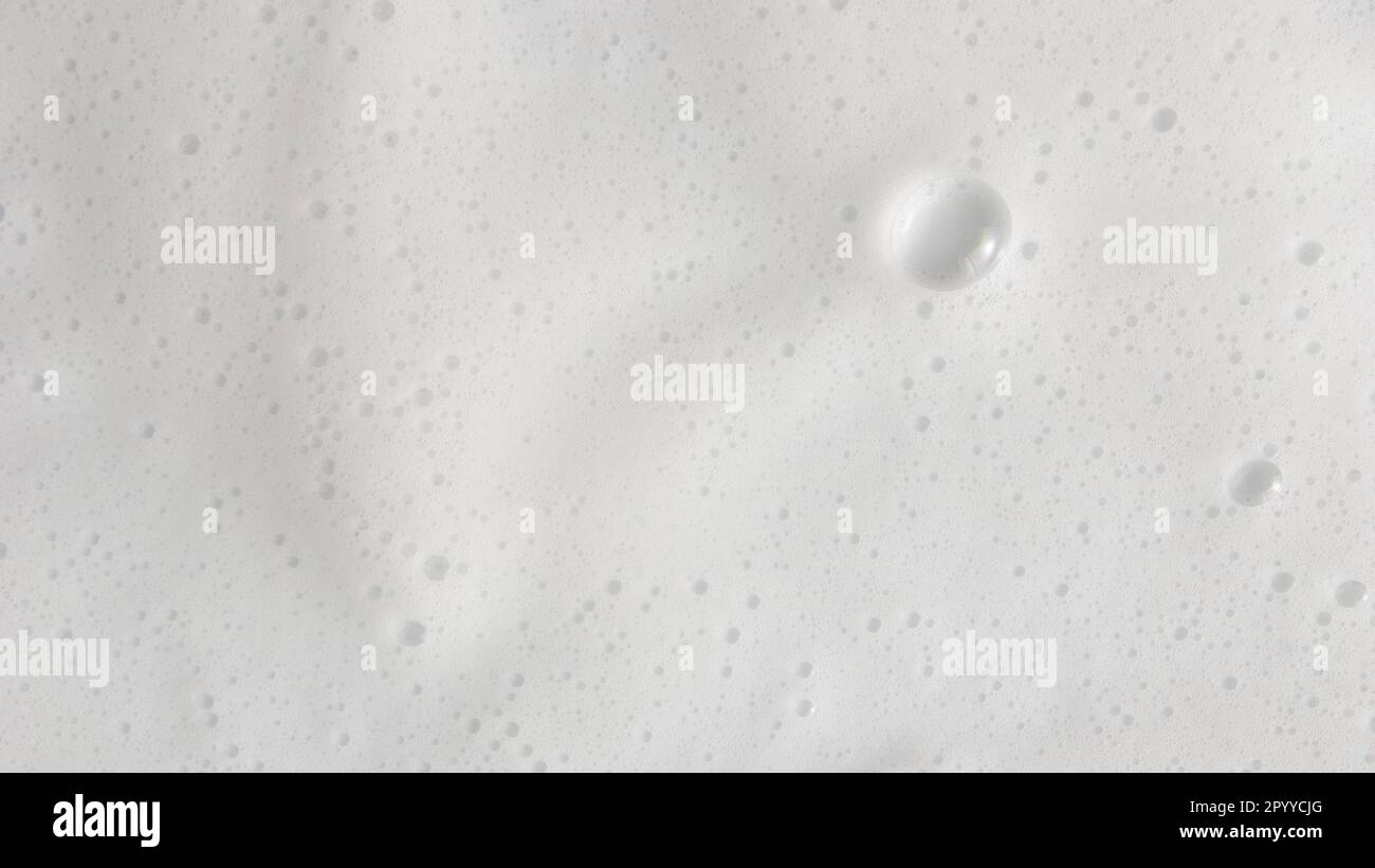 Abstract background white soapy foam texture. Shampoo foam with bubbles ...