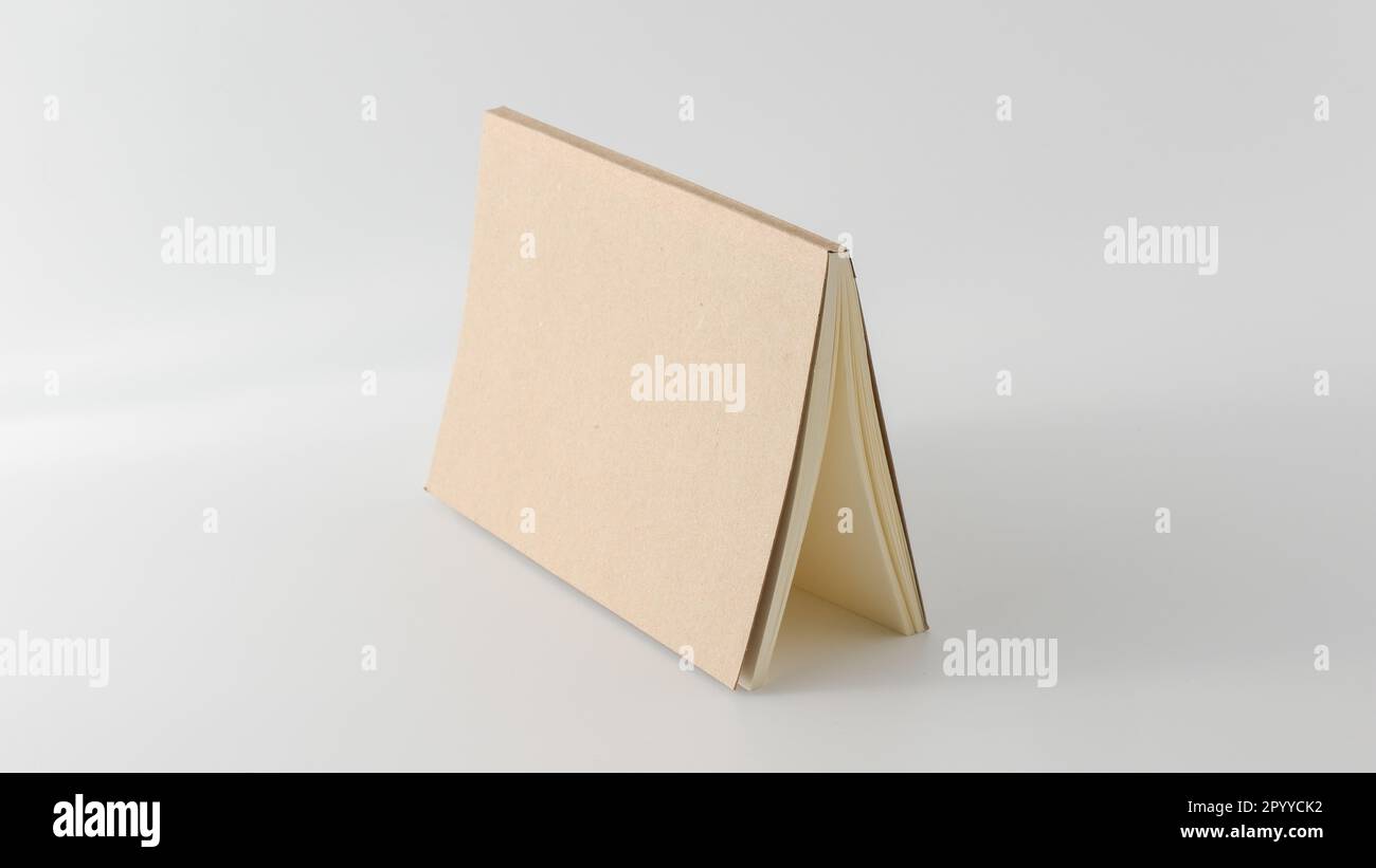 Recycled paper book on white background Stock Photo - Alamy
