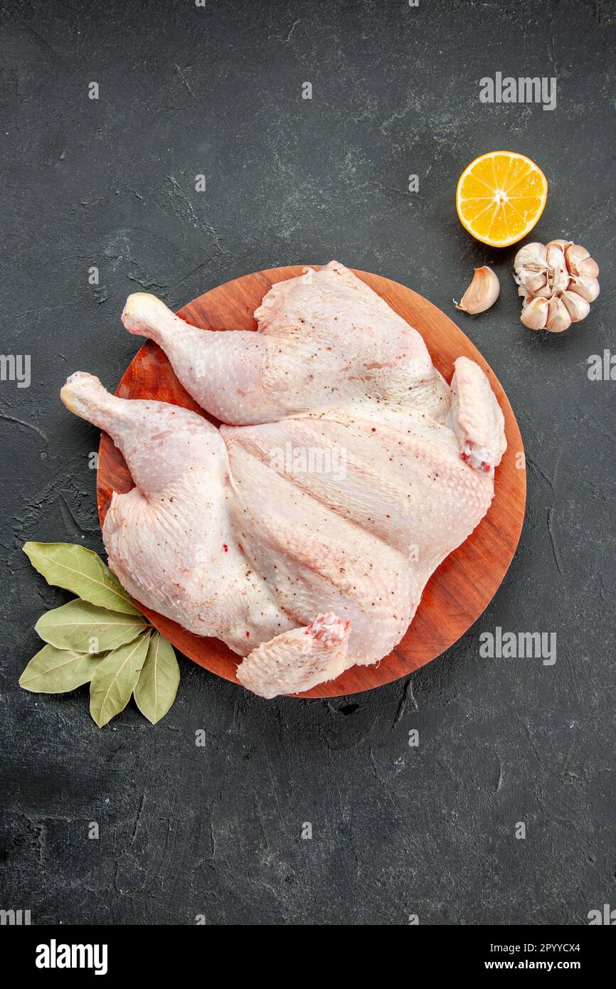 top view fresh chicken on the dark background cooking dish food salad ...