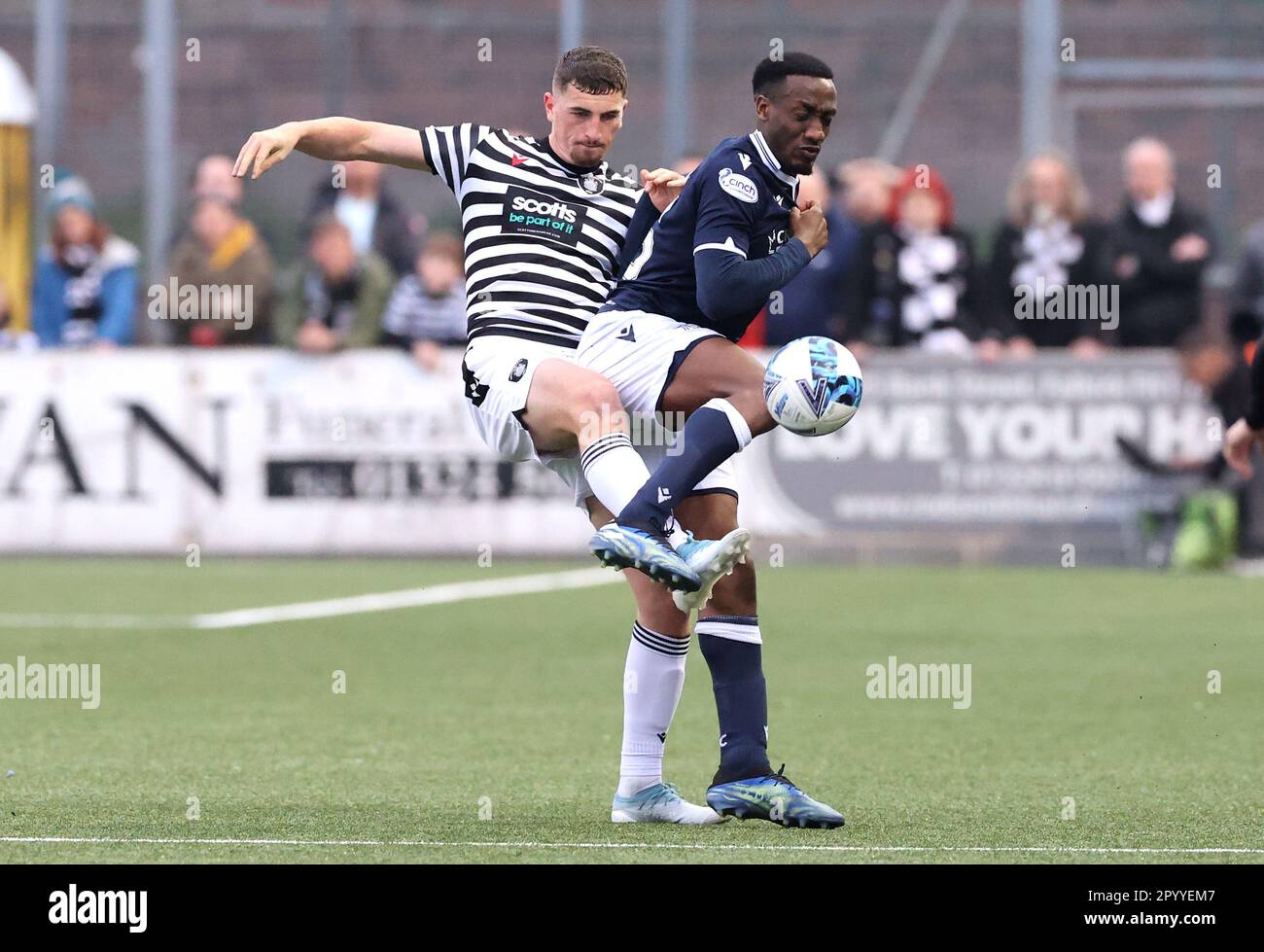 Queens Park's Charlie Fox (left) and Dundee's Zach Robinson battle for ...
