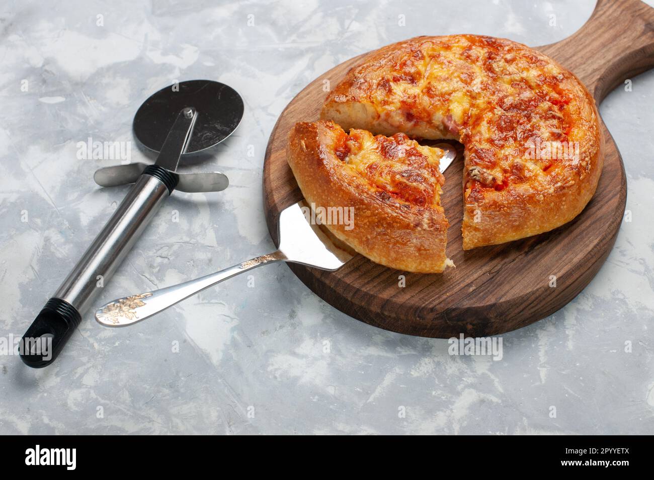 front view sliced pizza baked with cheese on light white background ...
