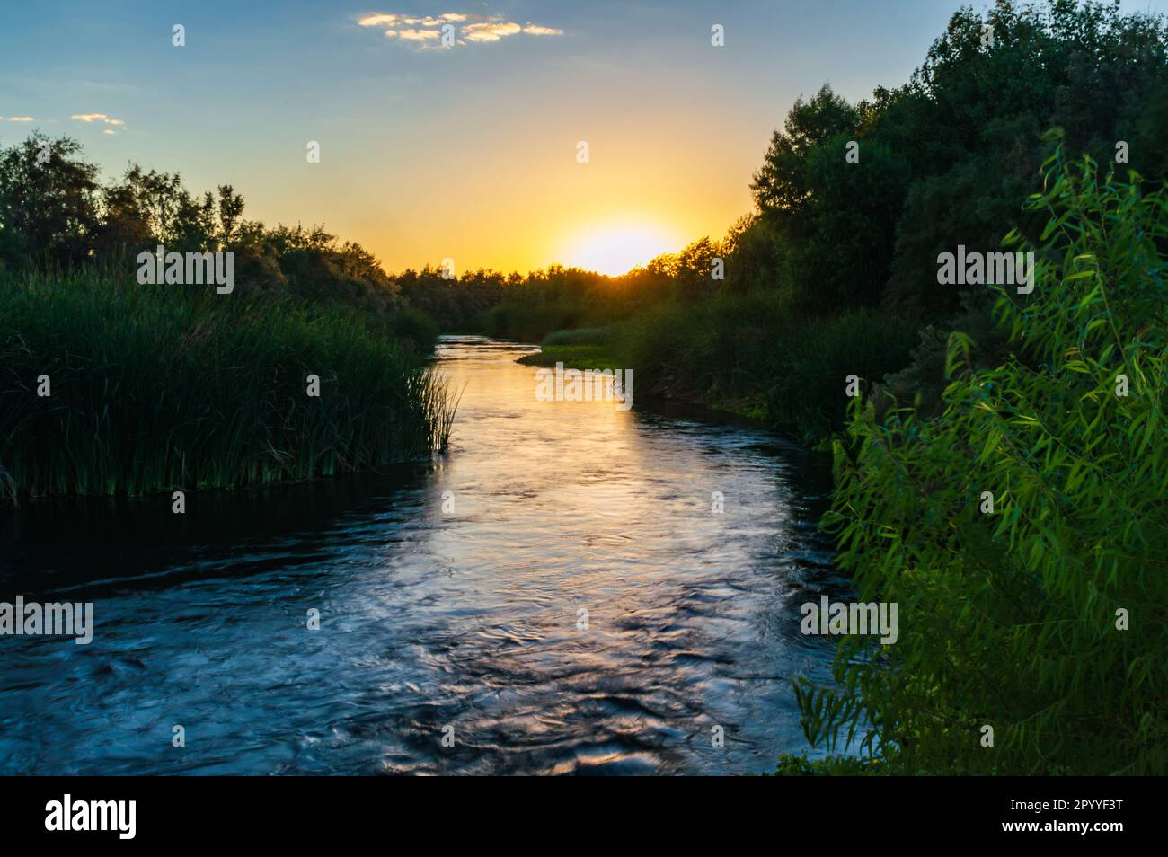 Color photograph of the Gila River flowing towards the sunset. Taken in ...