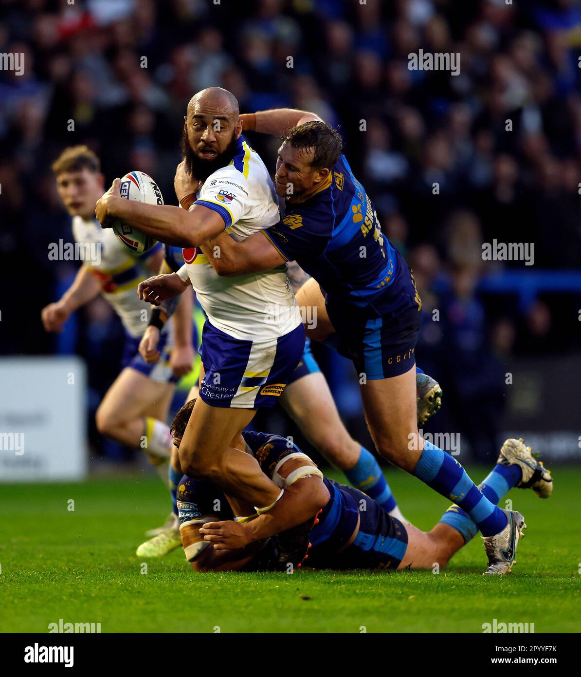 Warrington Wolves' Sam Kasiano gets tackled during the Betfred Super ...