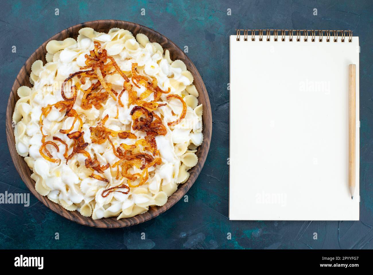 top view cooked italian pasta inside plate on blue desk dough meal food ...