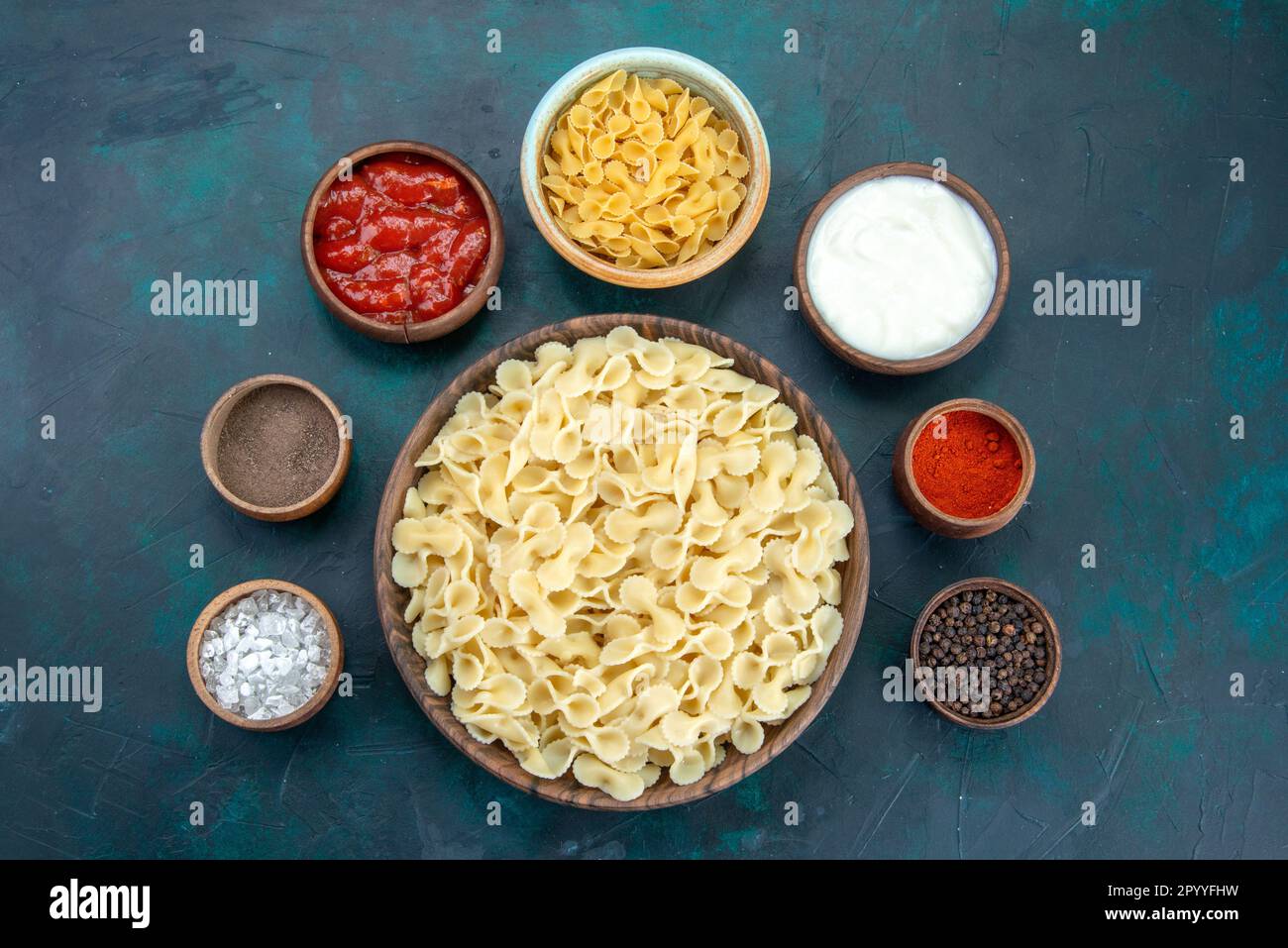 top view cooked italian pasta with seasonings on dark background meal ...