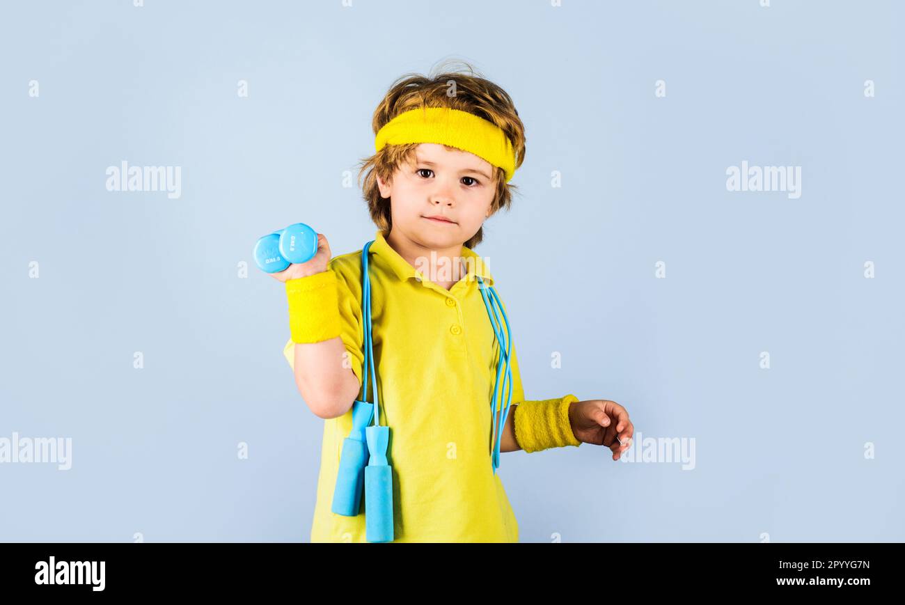 Sport and healthy lifestyle. Sporty boy with skipping rope and ...