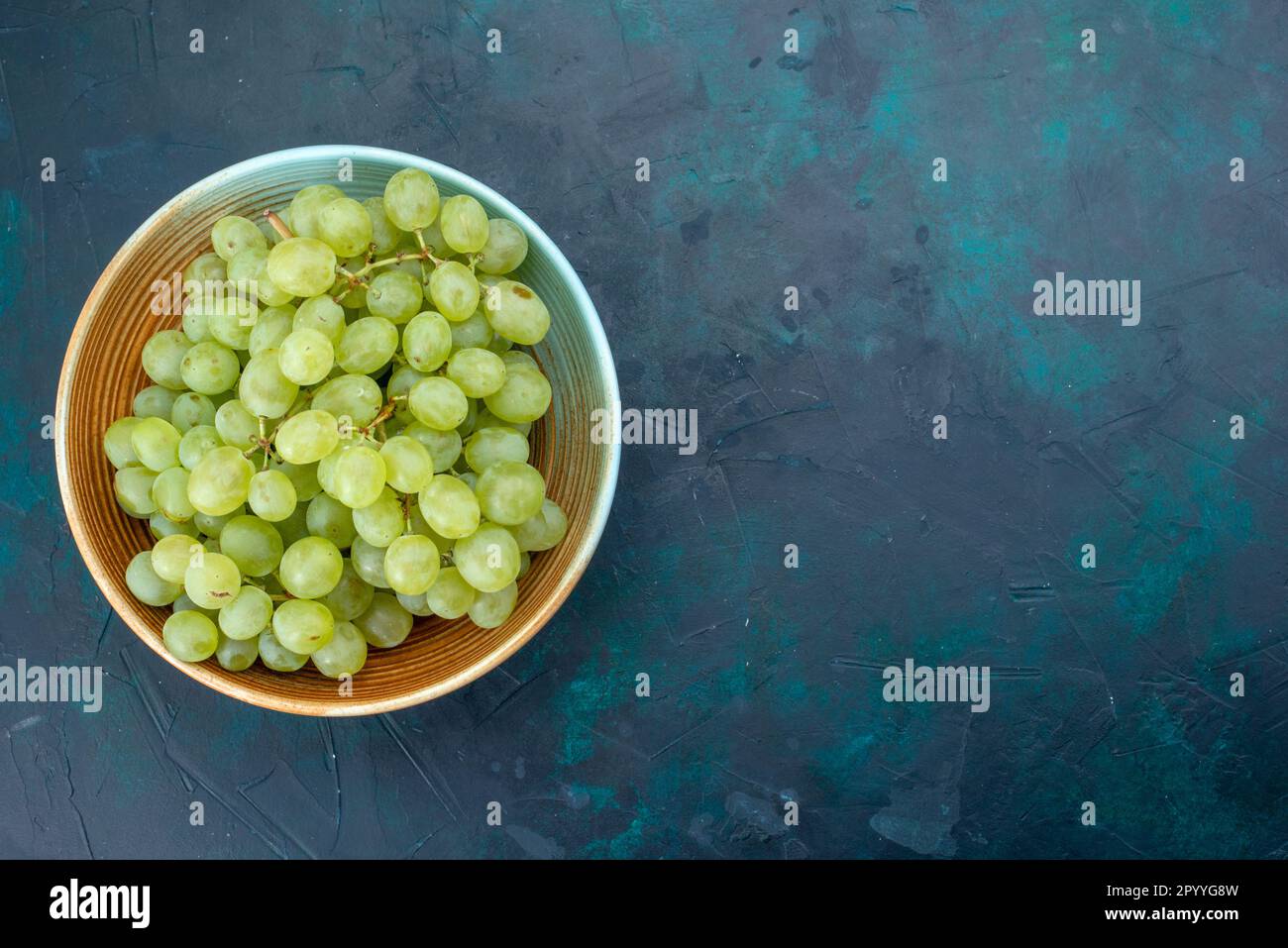 top view fresh green grapes on dark-blue background fruit mellow juicy ...