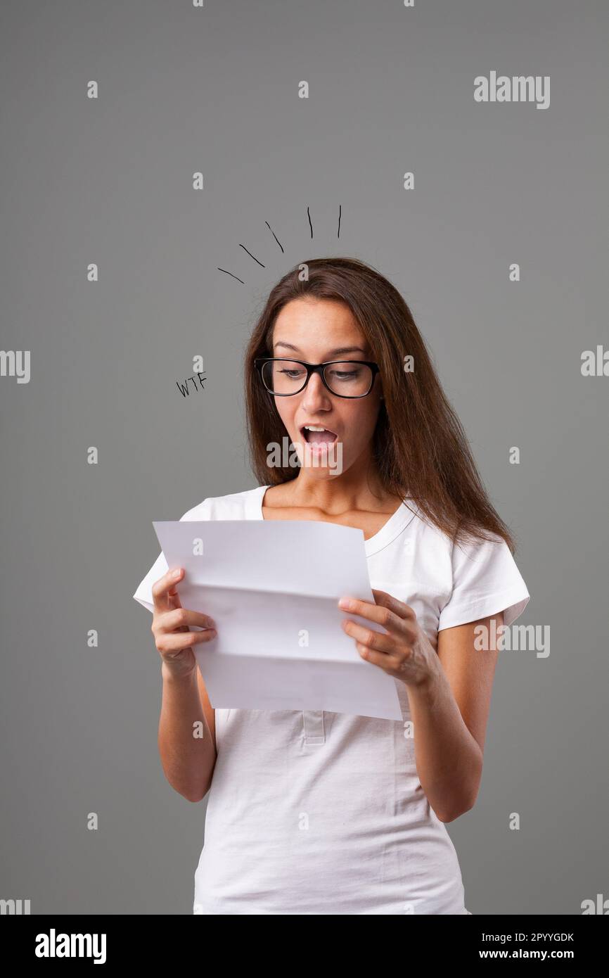 Emotional portrait of a young woman isolated on a neutral background ...