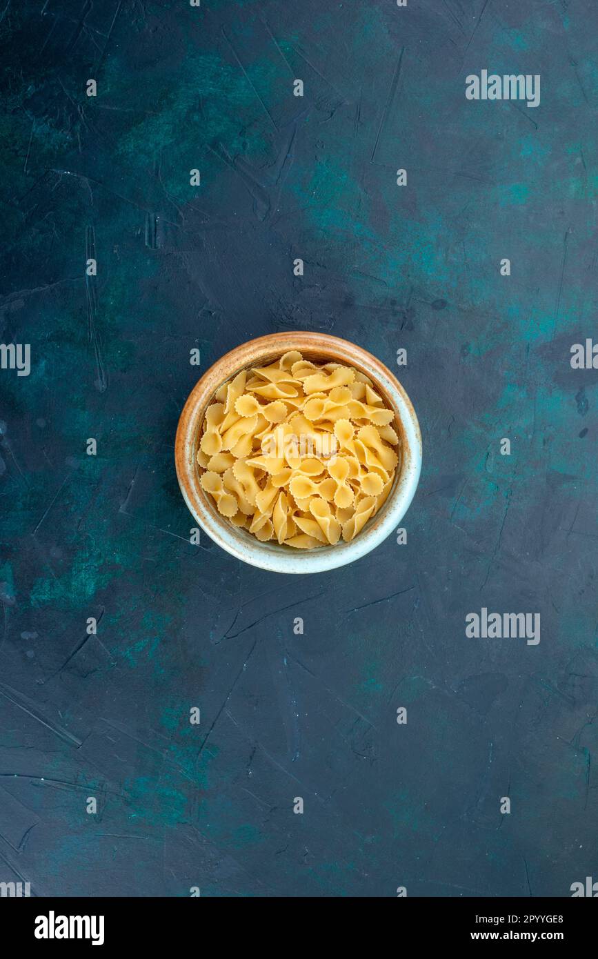 top view raw pasta inside little pot on dark background raw meal food ...