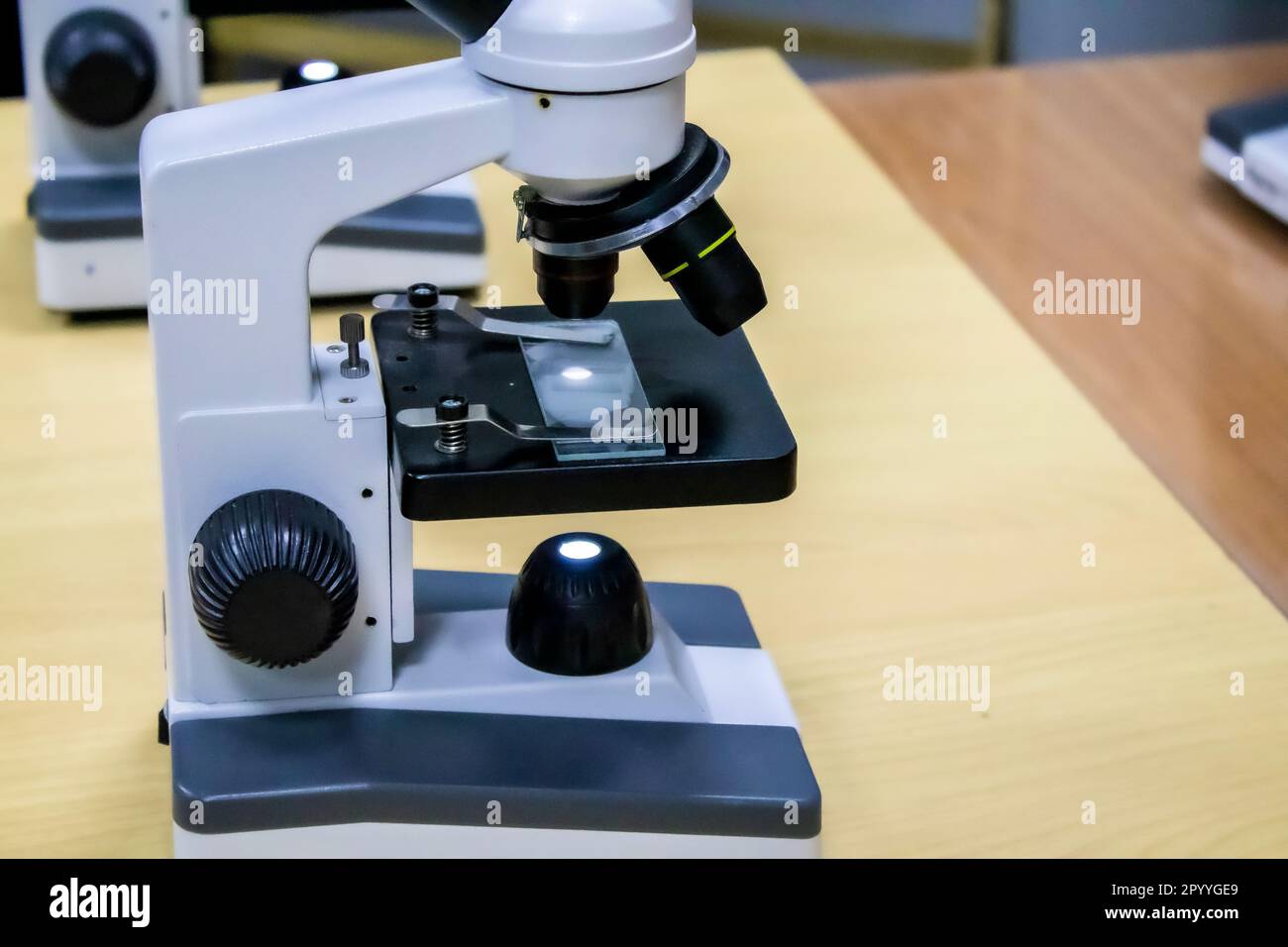 Old vintage microscope on table sepia photo Stock Photo - Alamy