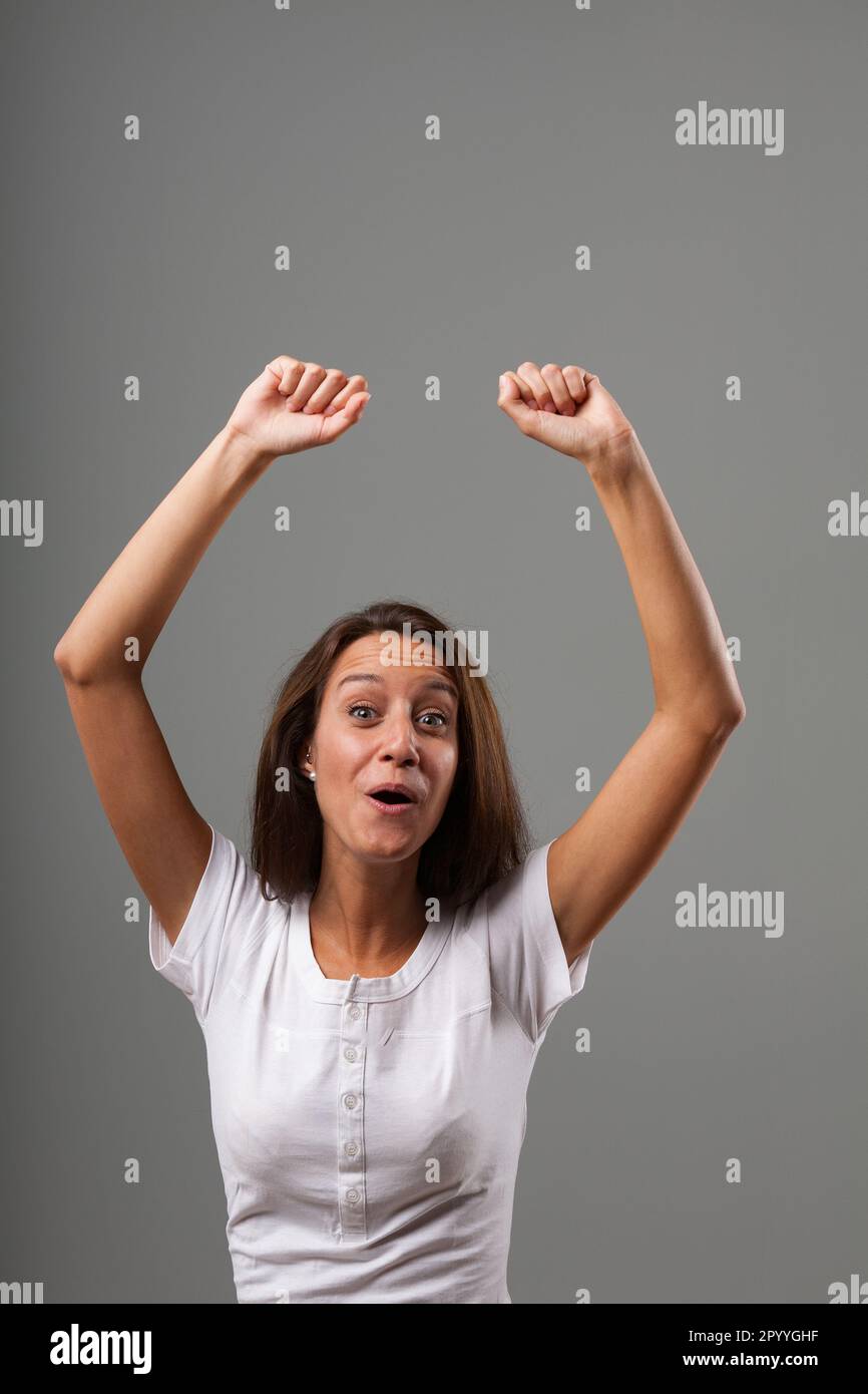 Emotional portrait of a young woman isolated on a neutral background ...